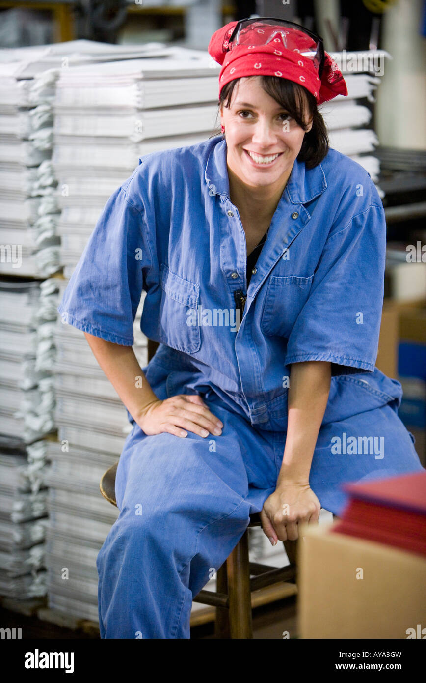 Female worker in overalls sitting hi-res stock photography and images ...