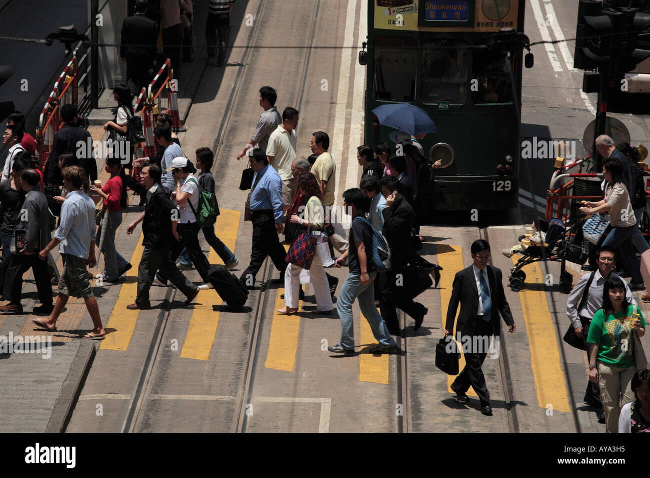 Asia Peoples Republic of China Hong Kong Pedestrians crowd crosswalk ...