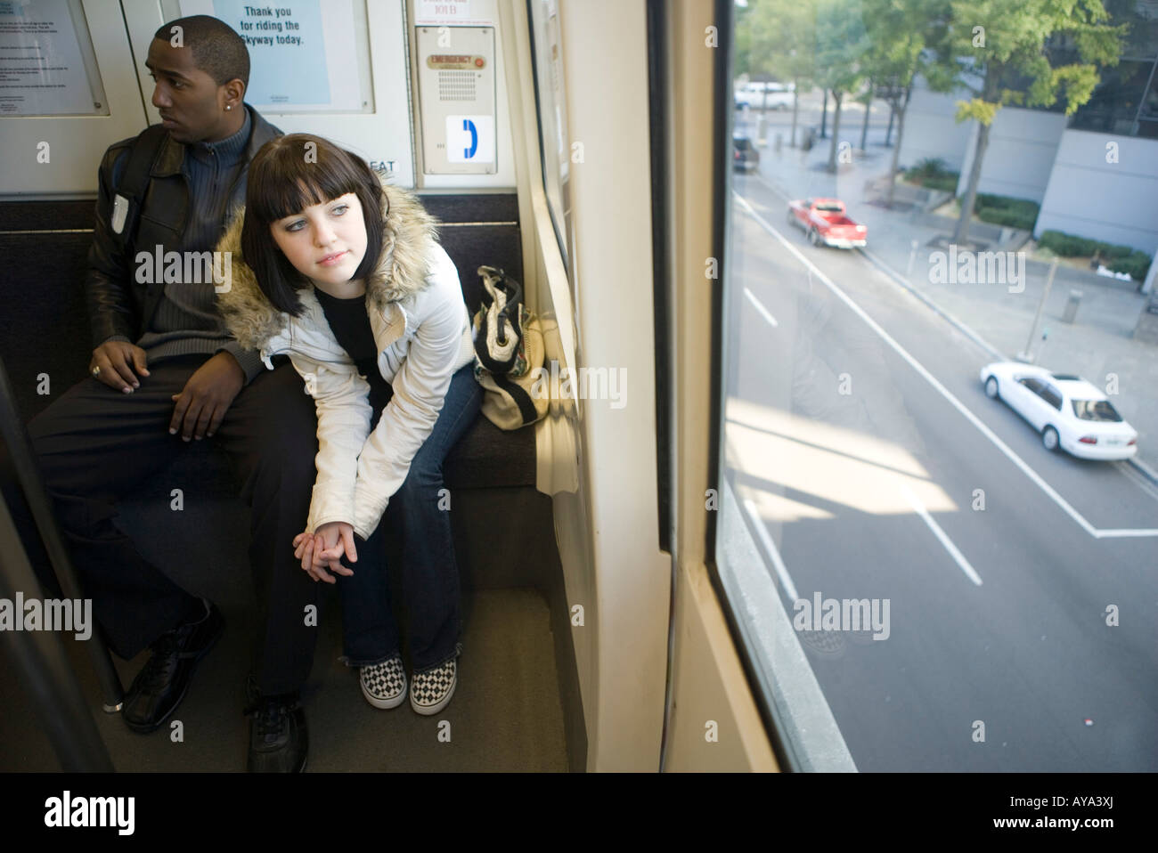 People riding a train Stock Photo - Alamy