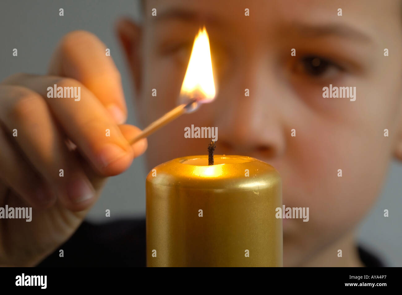 Child lights a candle Stock Photo - Alamy