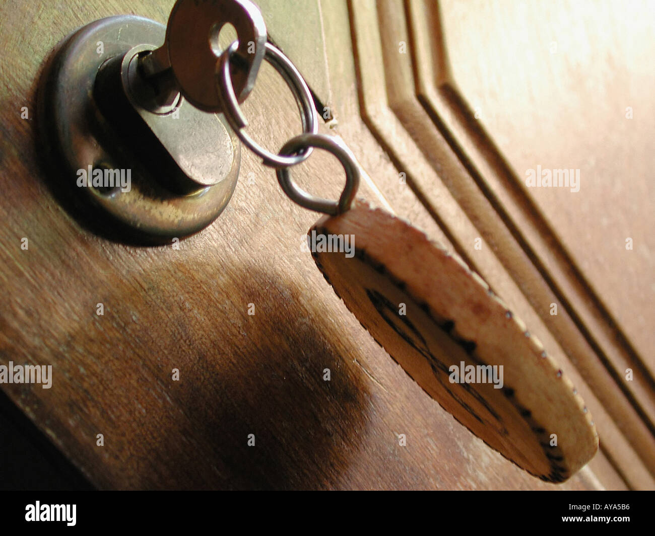 Key in the door Stock Photo - Alamy