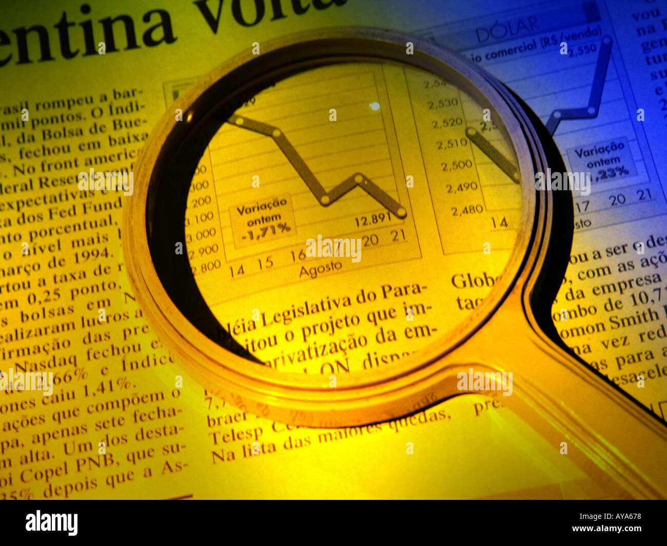 Magnifying glass on newspaper Stock Photo - Alamy