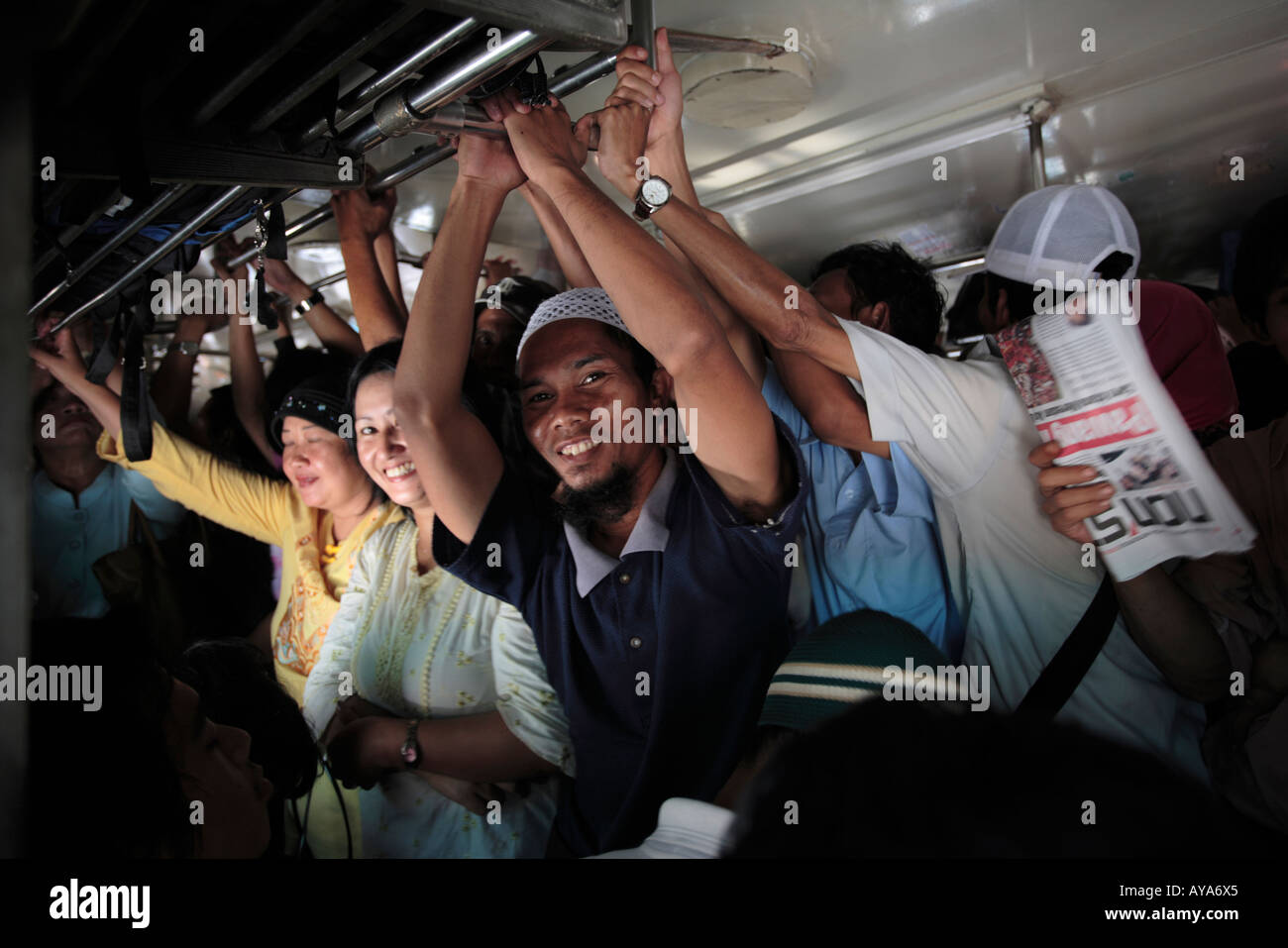 Indonesia Jakarta Passengers crowd onto commuter train at Kota Railway ...