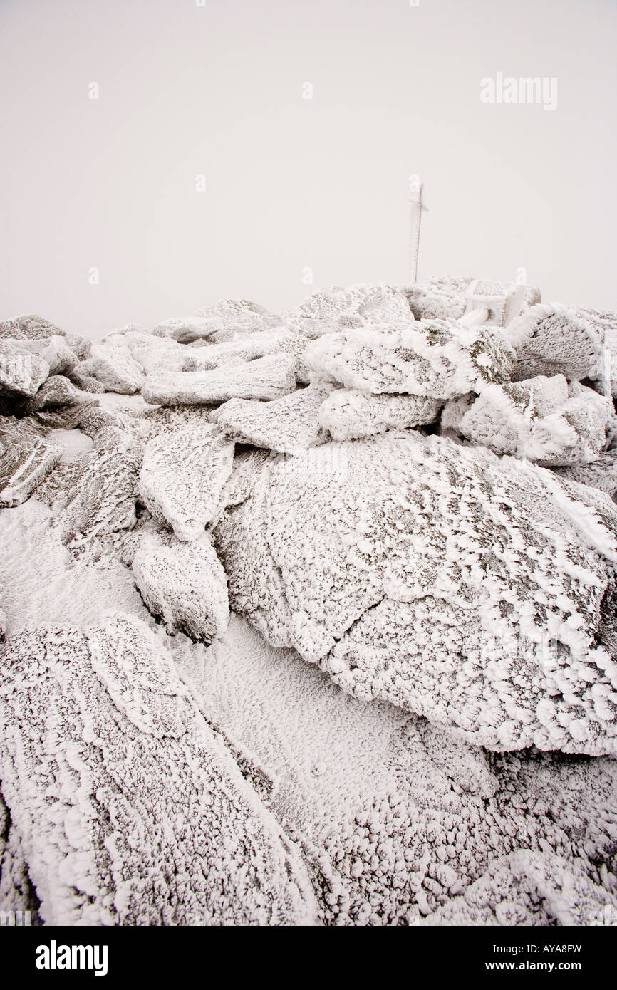 Rime ice covers the rocks and a trail sign on Mount Washington in New ...
