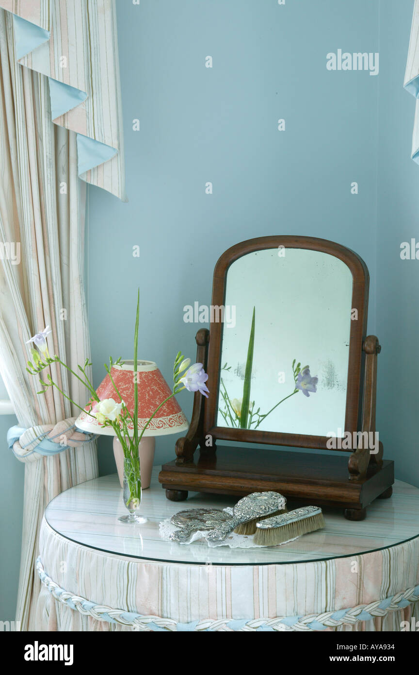 bedside table with flowers in new house Stock Photo - Alamy