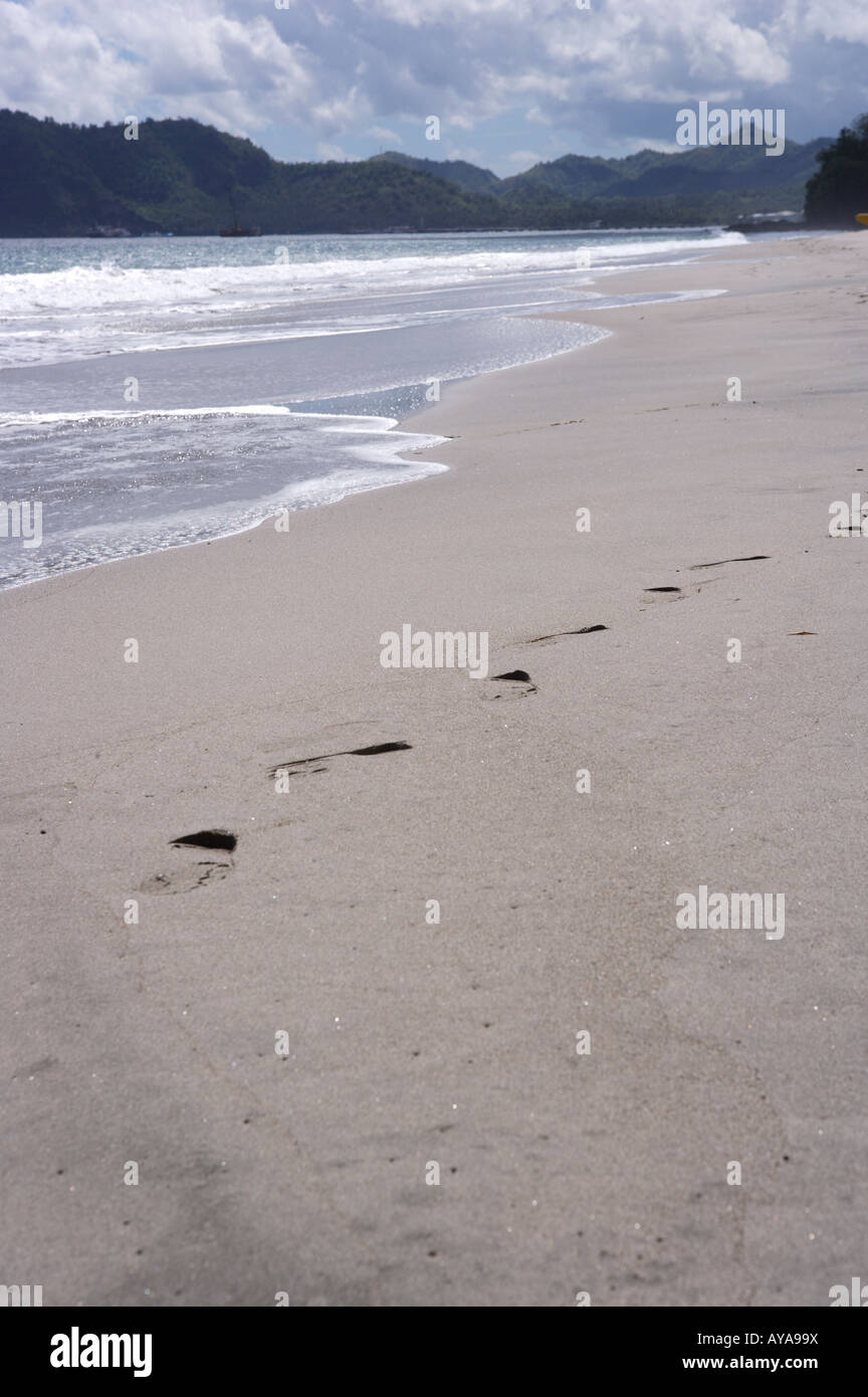 Footprints on a sandy beach in Bali Stock Photo - Alamy