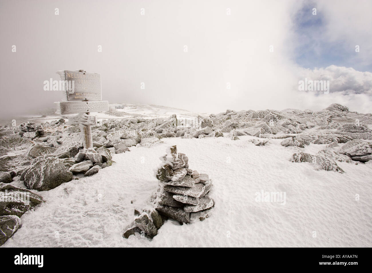 Rime ice covers the rocks and a trail sign on Mount Washington in New ...
