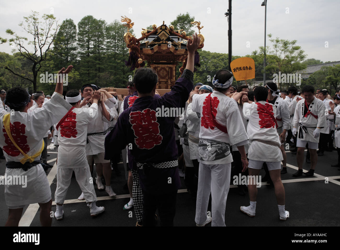 Asia Tokyo Japan Procession carries Shinto shrine down street toward ...