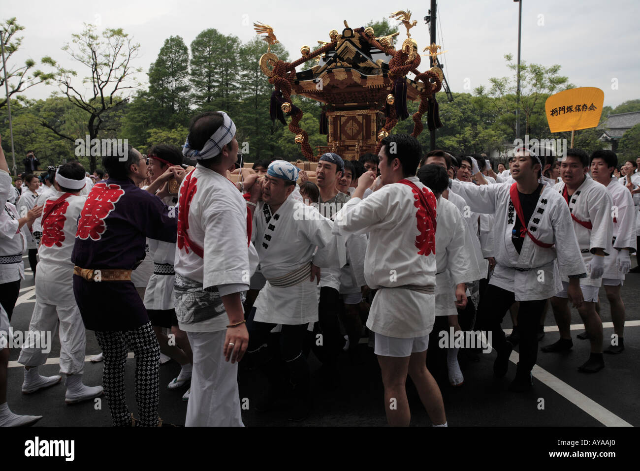 Asia Tokyo Japan Procession carries Shinto shrine down street toward ...
