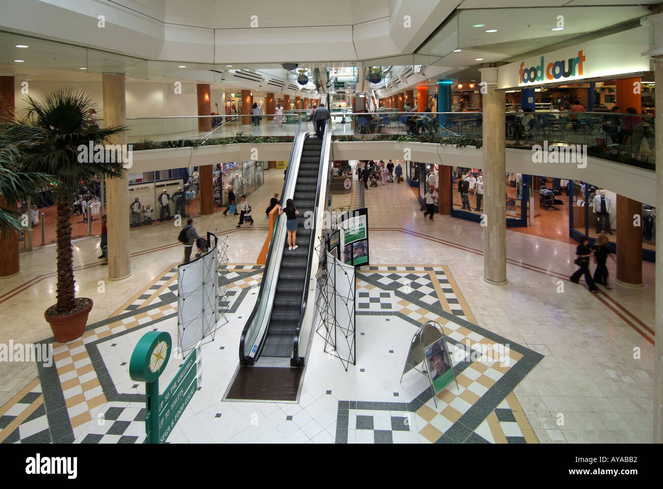 Basildon new town indoor shopping mall complex with escalators and shop ...