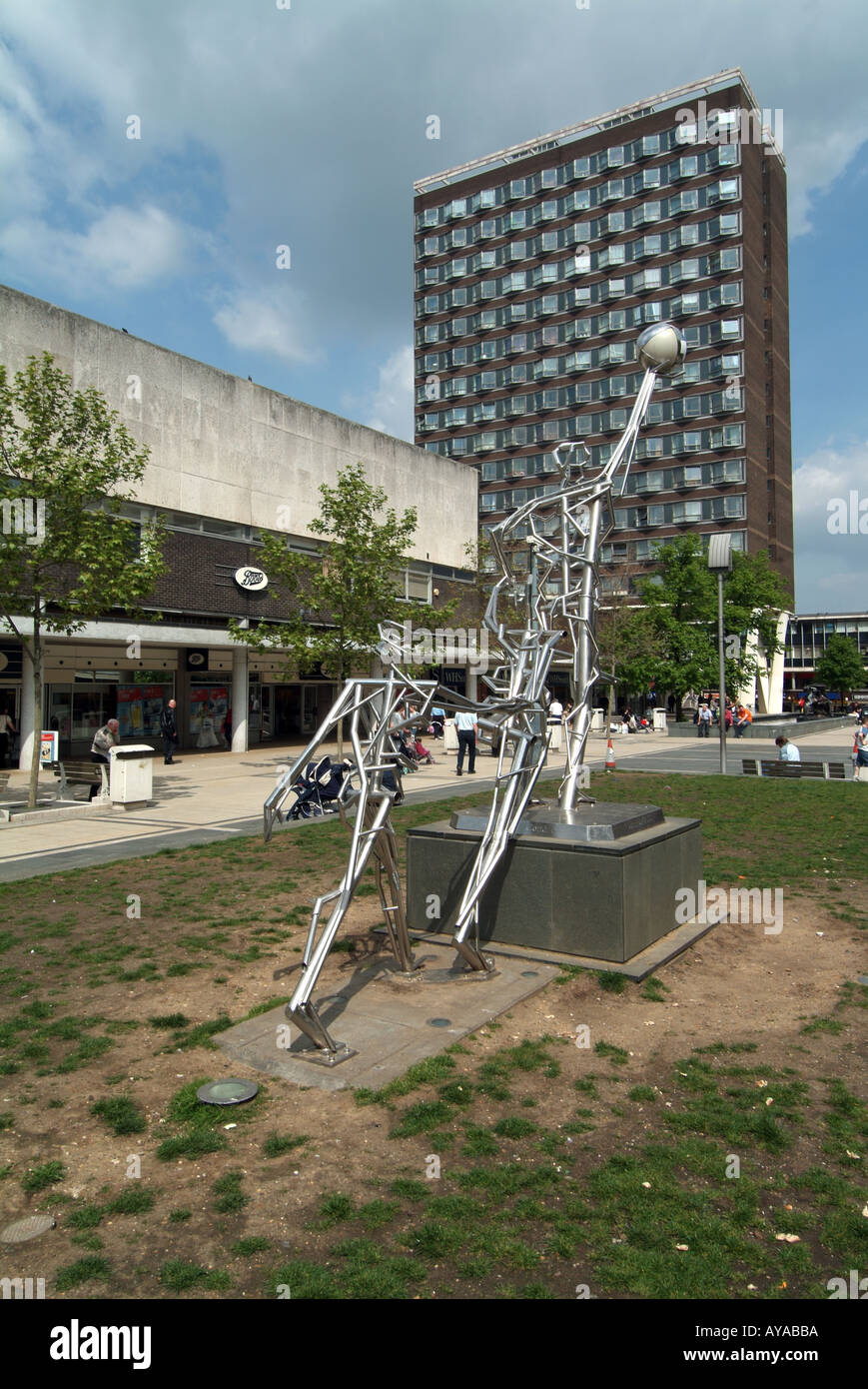 Basildon new town centre open space with shop units and high rise flats ...