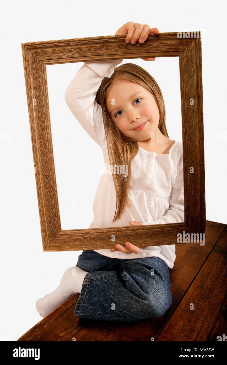 A girl holding a picture frame Stock Photo - Alamy