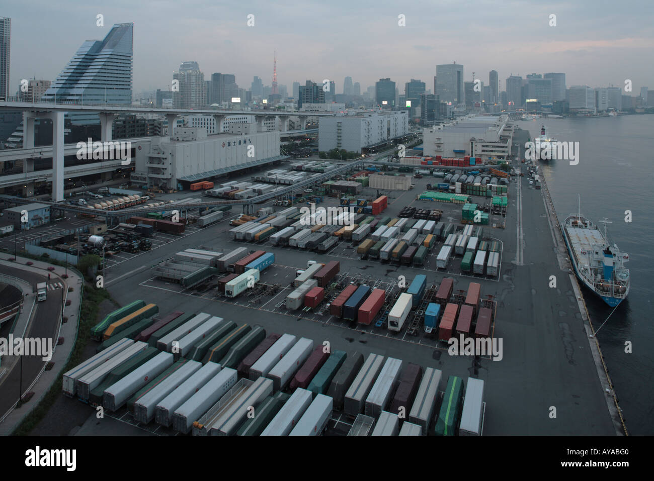 Asia Tokyo Japan Cargo containers fill terminal under Rainbow Bridge at ...