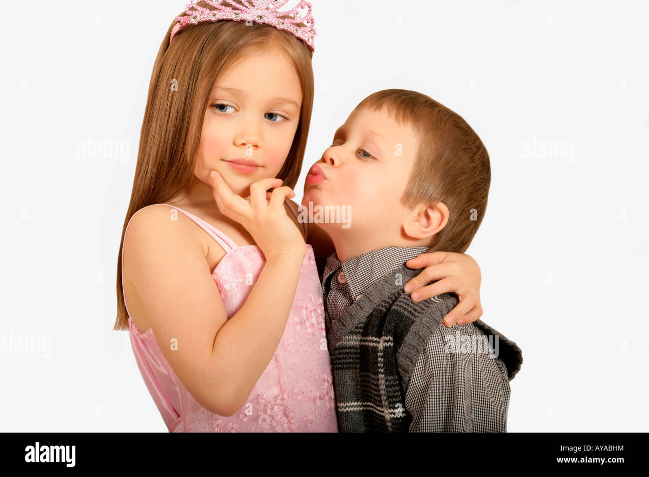 Boy trying to kiss princess Stock Photo - Alamy