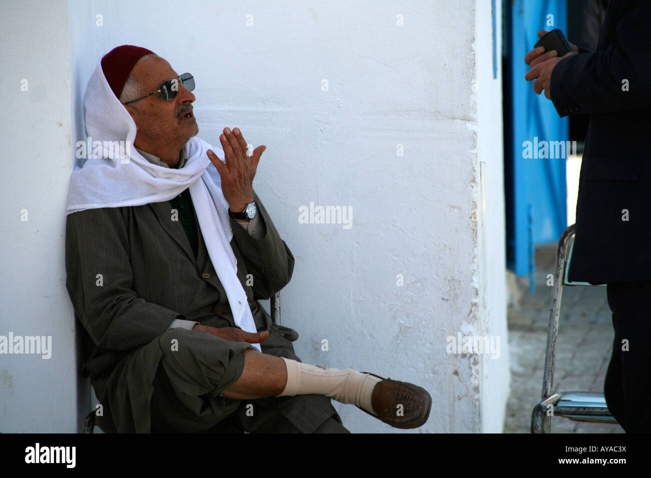 Muslim Man talking in Kairouan Tunisia North Africa Stock Photo - Alamy