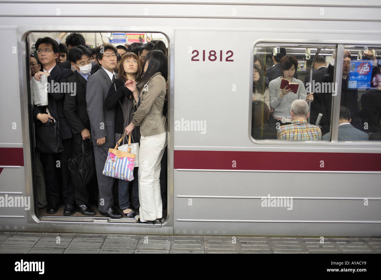 Asia Tokyo Japan Commuters crowd onto subway train during morning rush ...