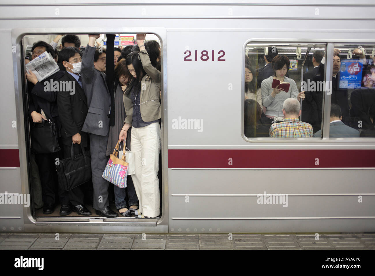 Asia Tokyo Japan Commuters crowd onto subway train during morning rush ...