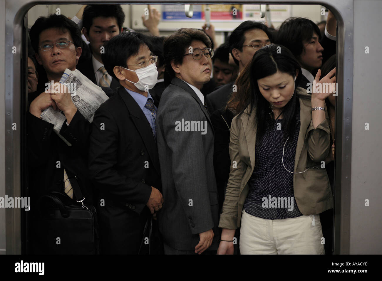 Asia Tokyo Japan Commuters crowd onto subway train during morning rush ...