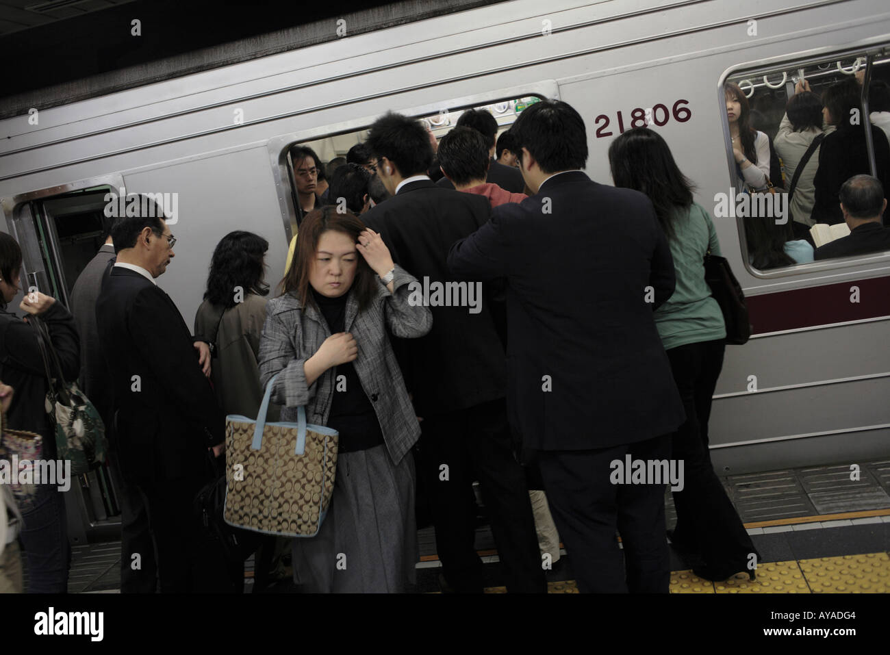 Asia Tokyo Japan Commuters crowd onto subway train during morning rush ...
