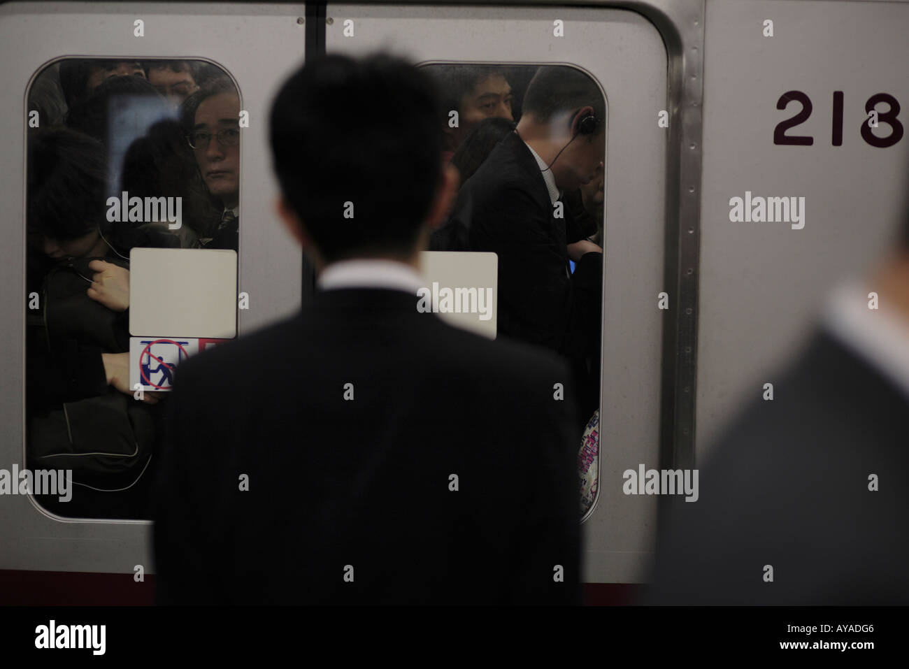 Asia Tokyo Japan Commuters crowd onto subway train during morning rush ...