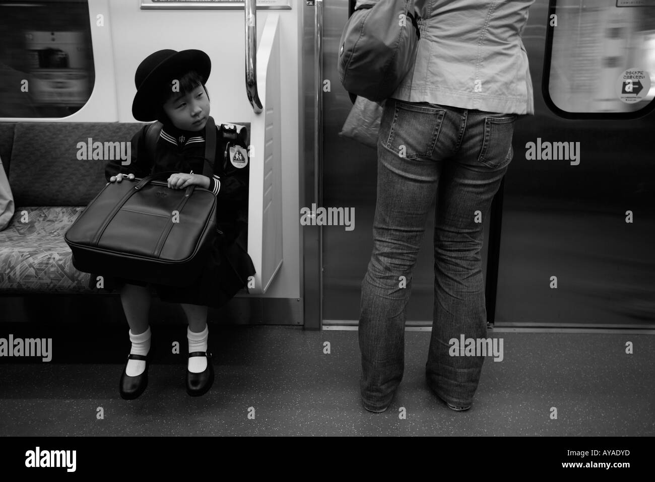 Asia Tokyo Japan Young school girl in uniform on subway train Stock ...