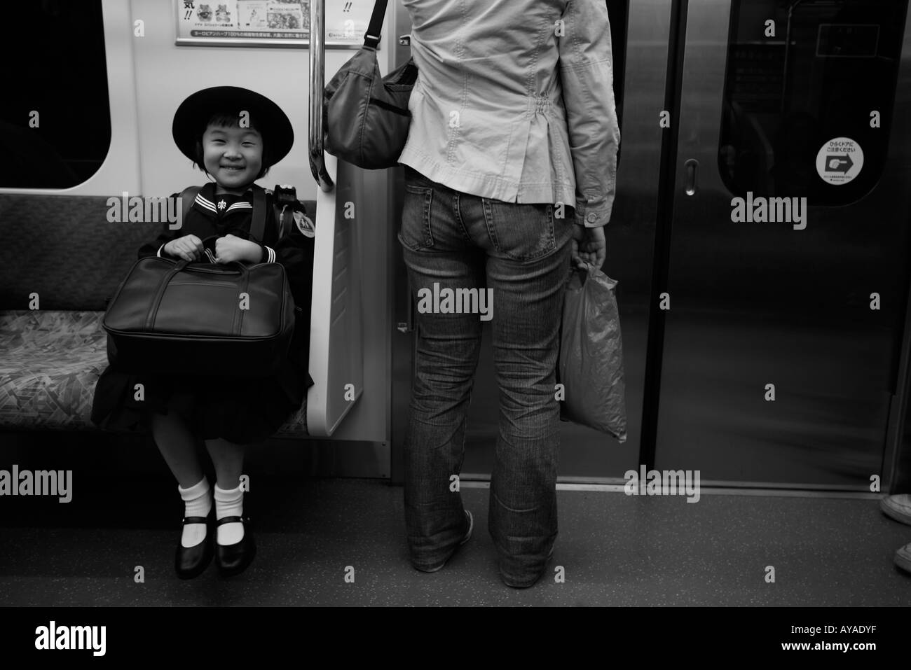 Asia Tokyo Japan Young school girl in uniform on subway train Stock ...