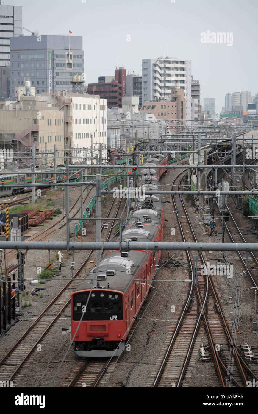 Asia Tokyo Japan Commuter train on tracks in Shinkuku District Stock ...