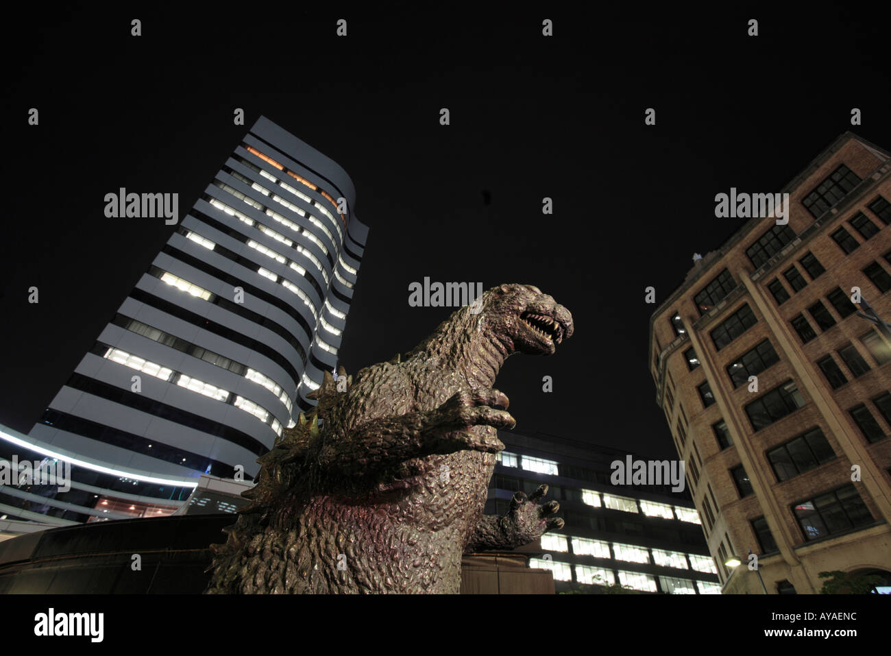 Asia Tokyo Japan Small statue of Godzilla in Hibiya District at night ...