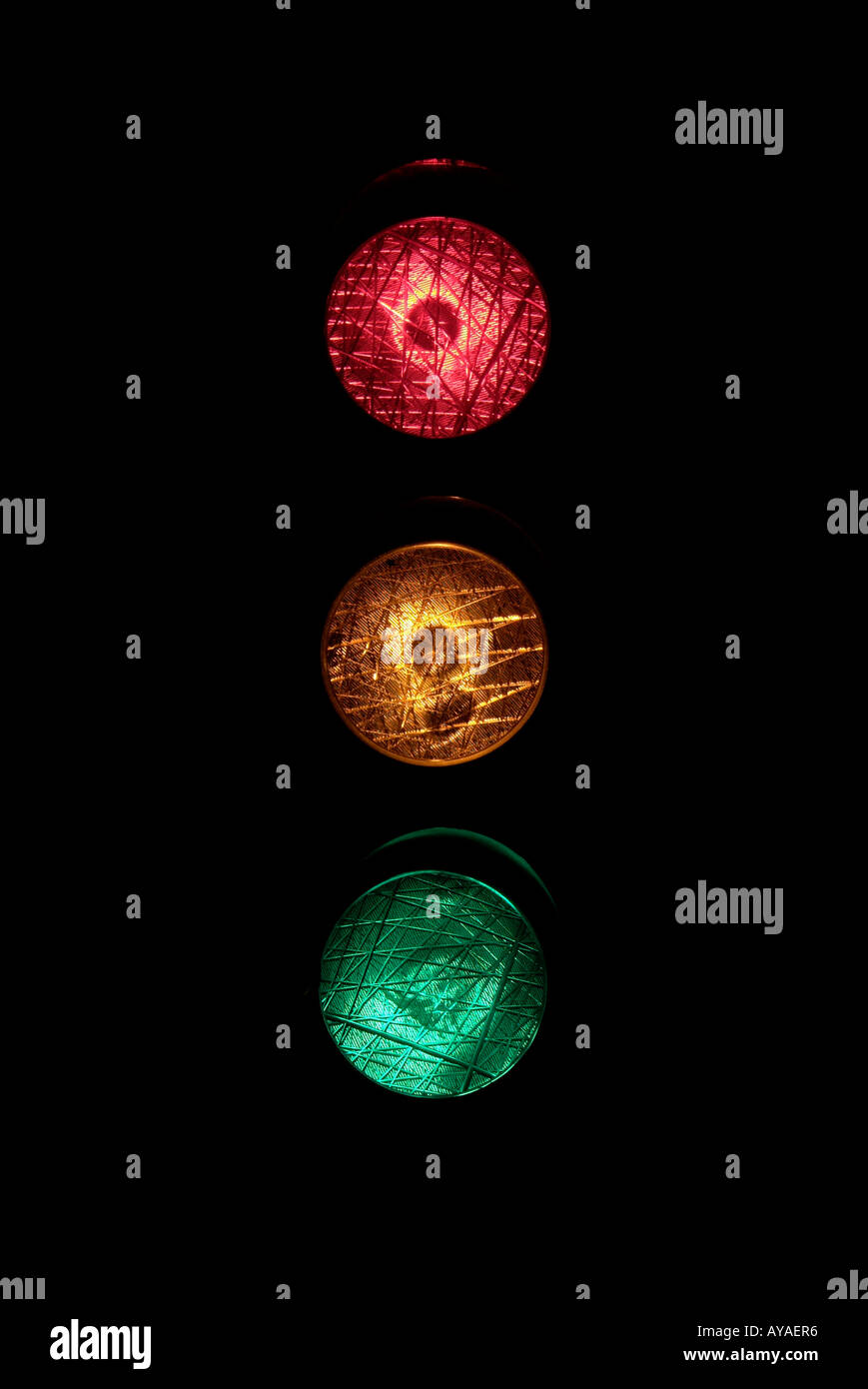 Traffic Light at Night with Red Orange and Green Lights Illuminated ...