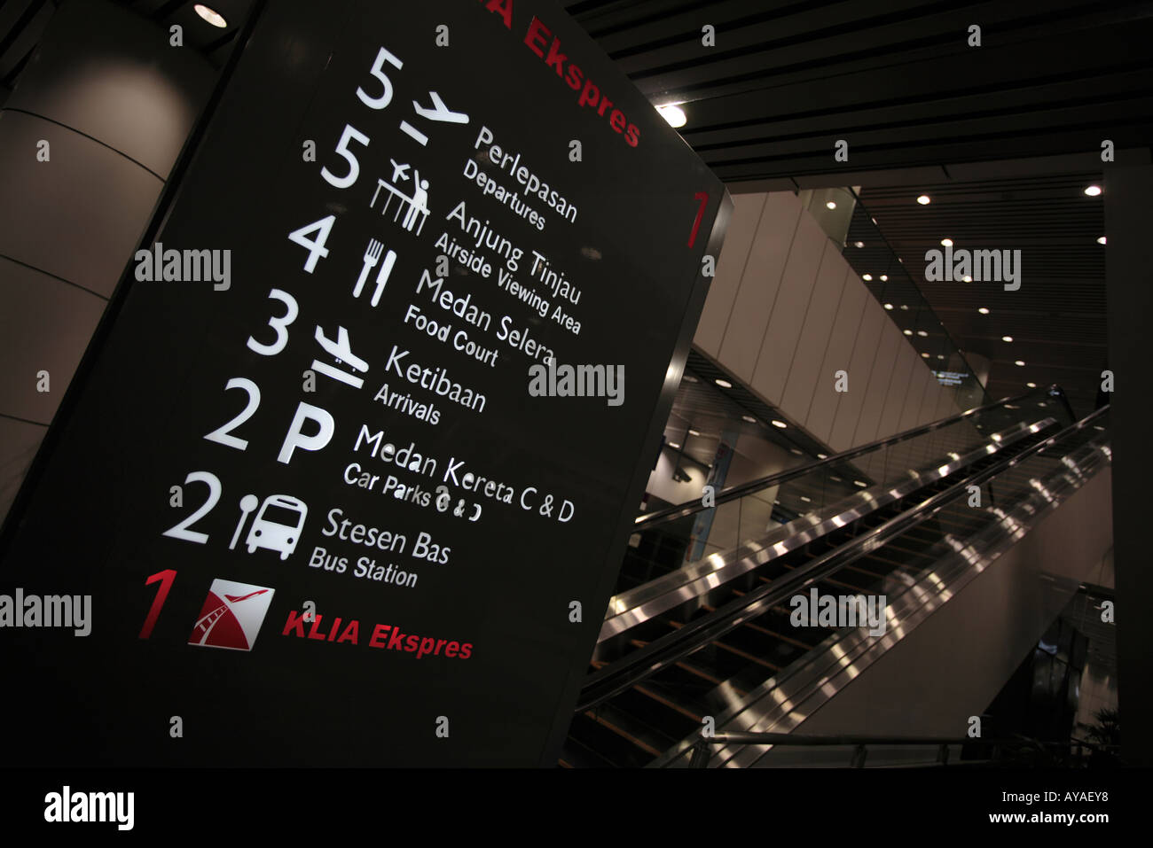 Malaysia Kuala Lumpur Illuminated sign by escalator inside KLIA subway ...