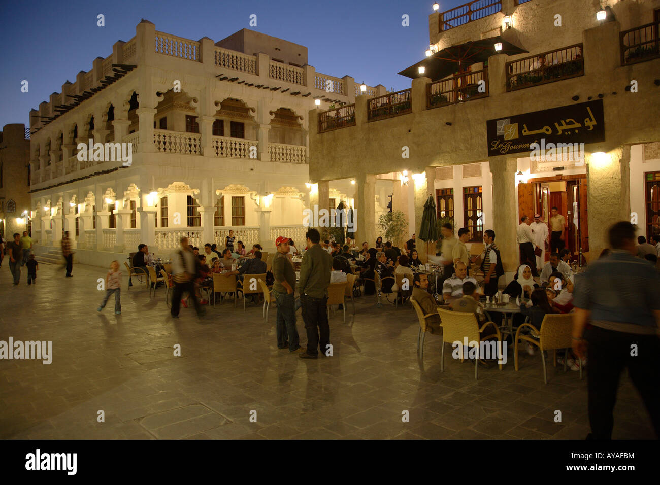 Qatar Doha Souq Waqif street scene restaurants people Stock Photo - Alamy