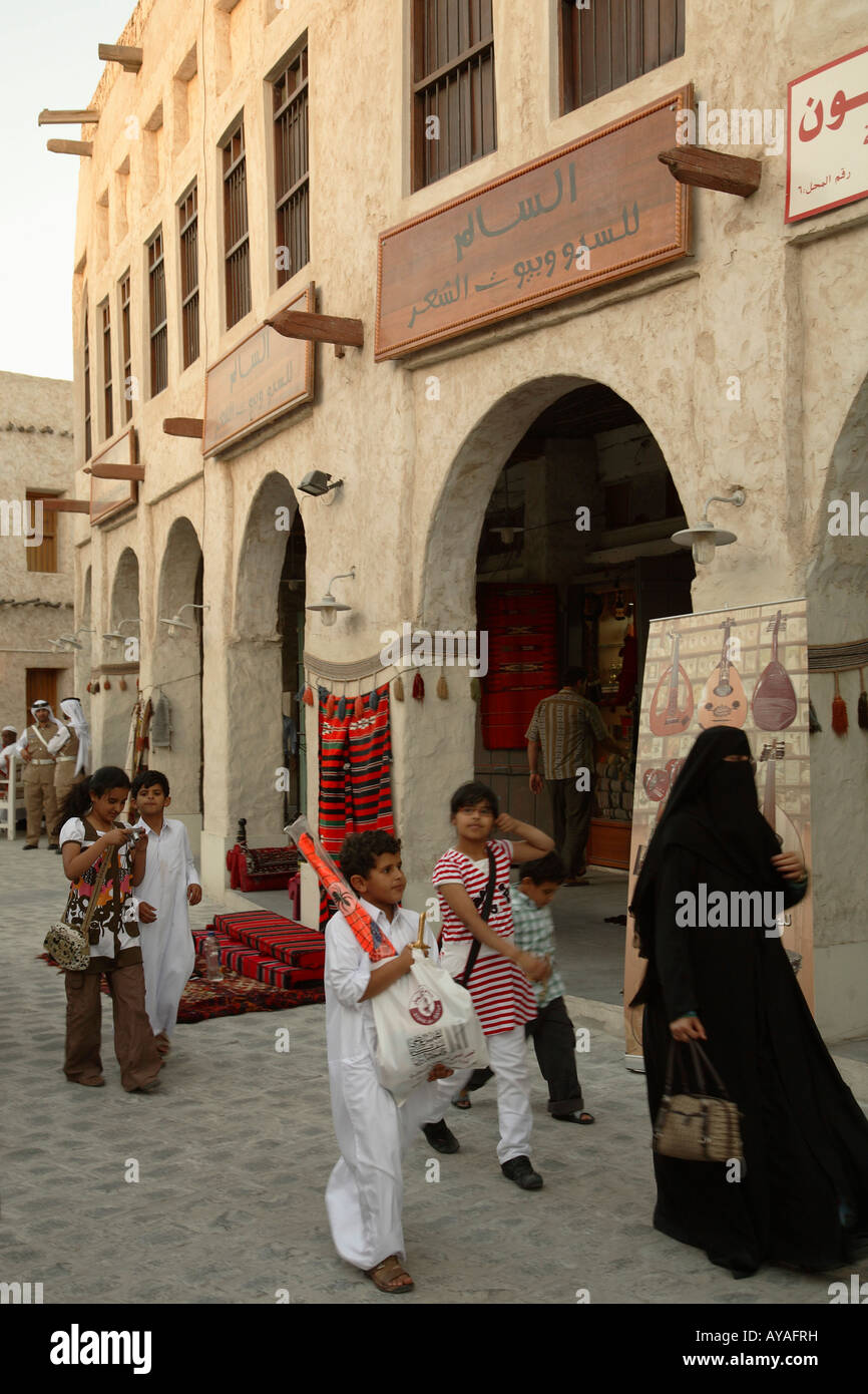 Qatar Doha Souq Waqif street scene shops people Stock Photo - Alamy