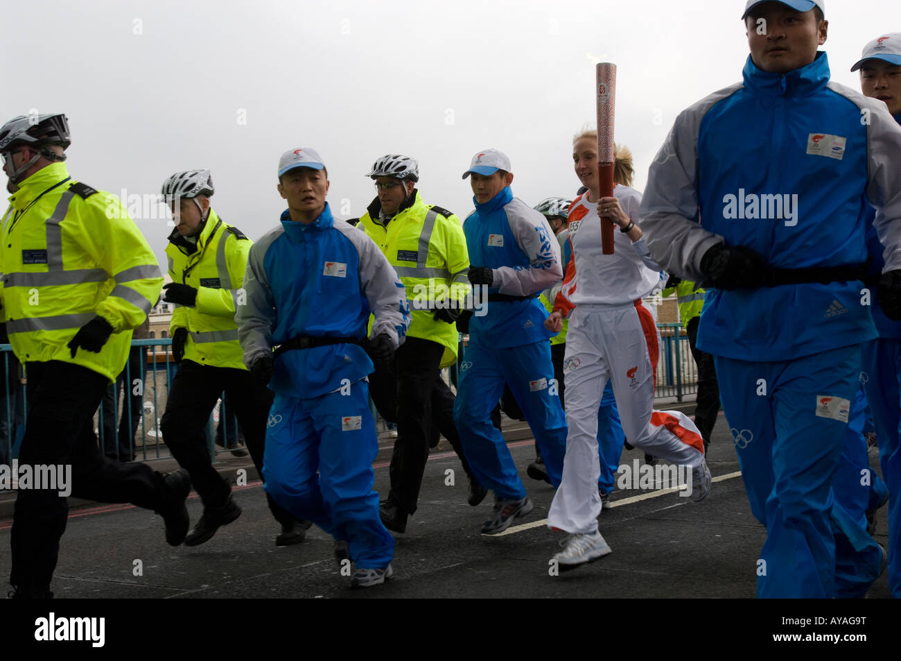 Paula Radcliffe with Olympic Torch on Tower Bridge during relay through ...