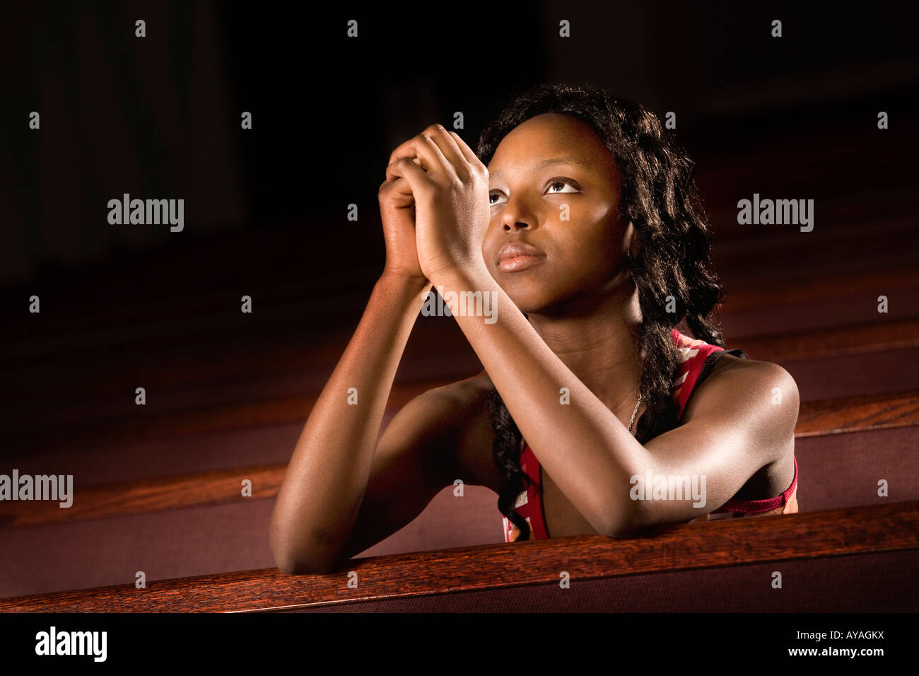 Girl praying church hi-res stock photography and images - Alamy