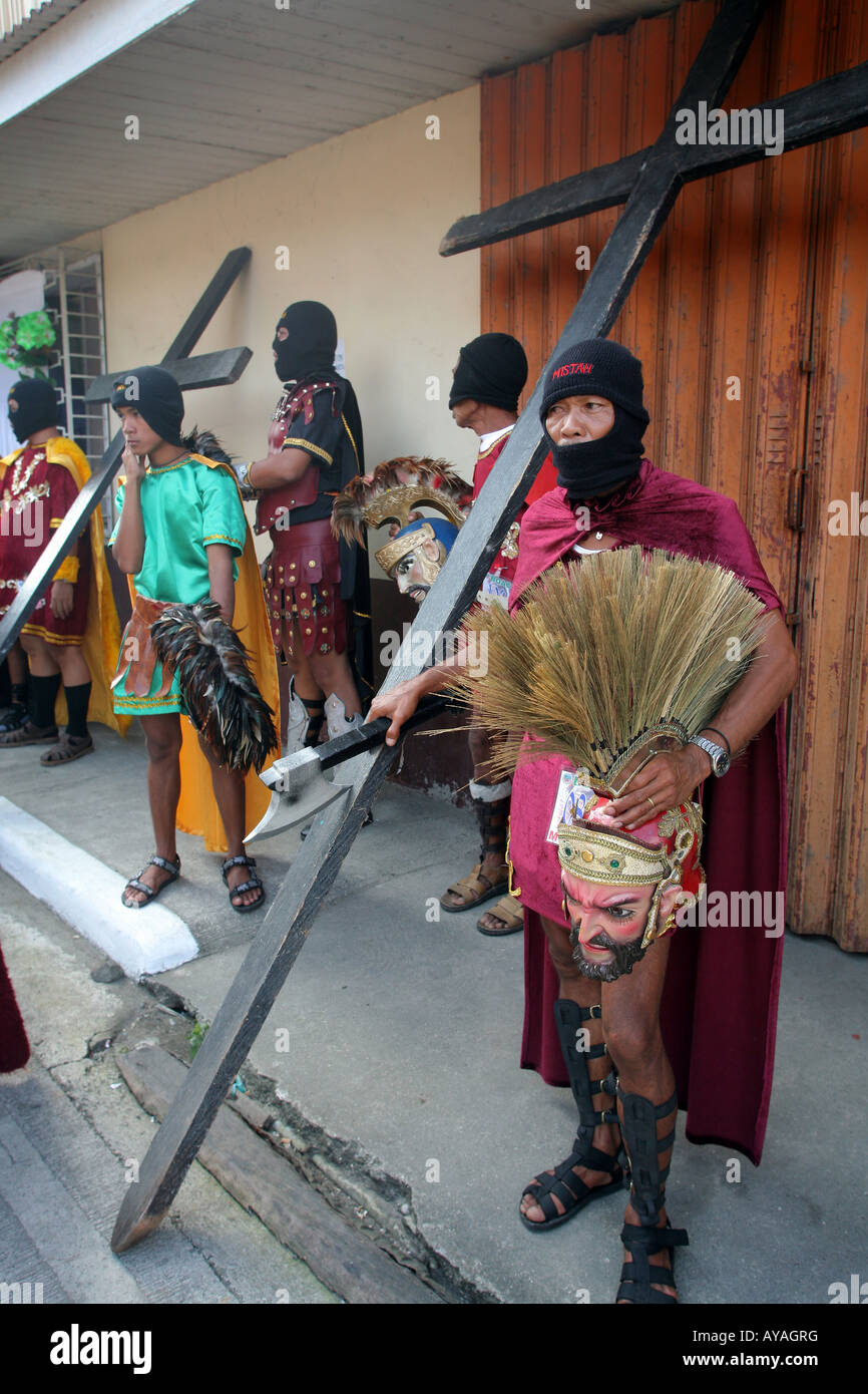 Way of the cross on Good Friday: roman soldiers waiting with the cross ...