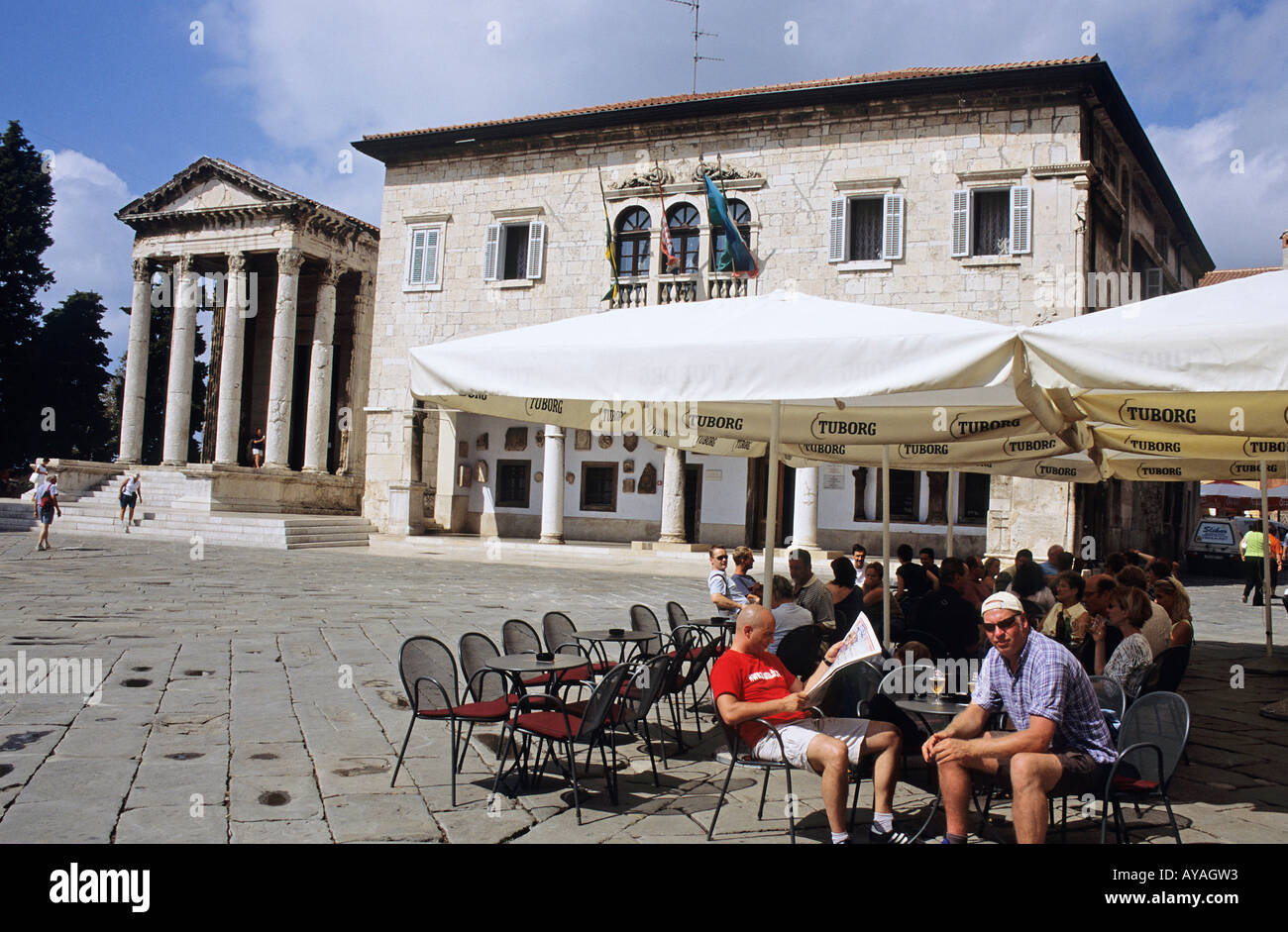 Roman temple of Augustus and gothic Town Hall with cafes in the main ...