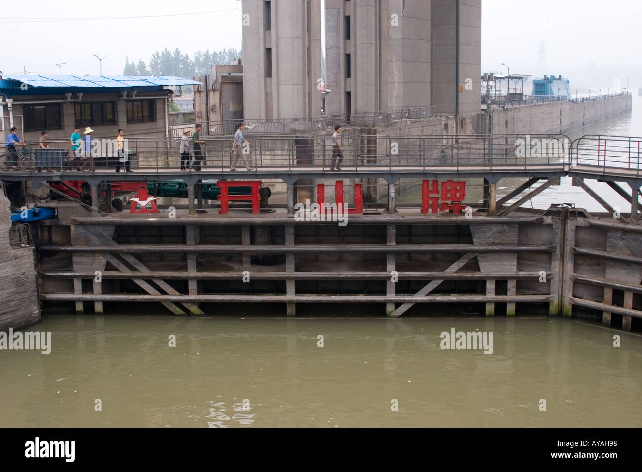 Local residents crossing the bridge formed by the closed Gezhouba ...