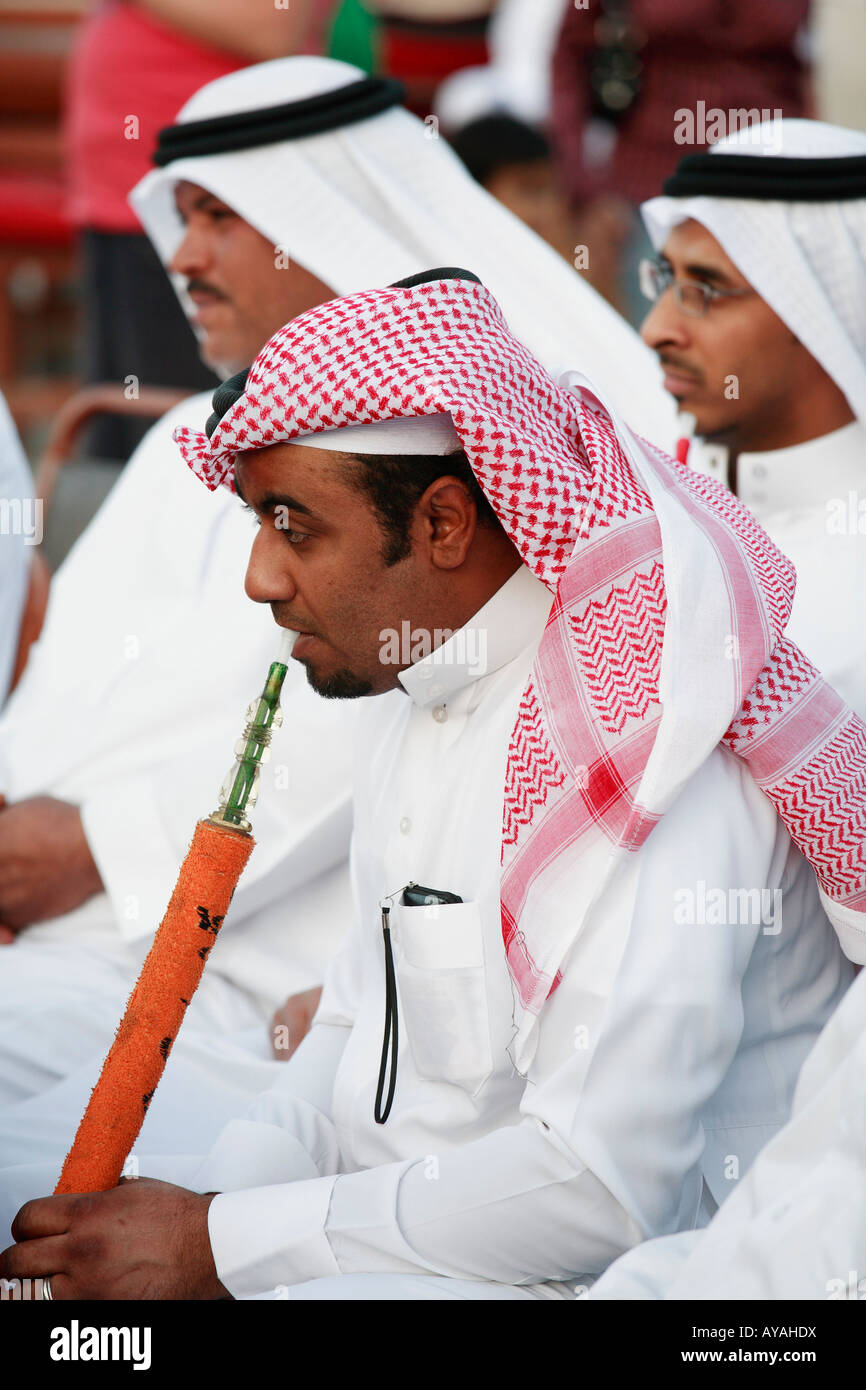 Qatar Doha Souq Waqif man smoking sheesha water pipe Stock Photo - Alamy