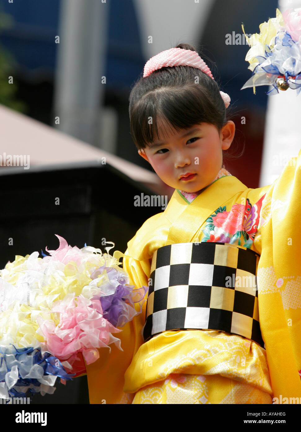Young Japanese girl modeling kimono fashions Stock Photo - Alamy