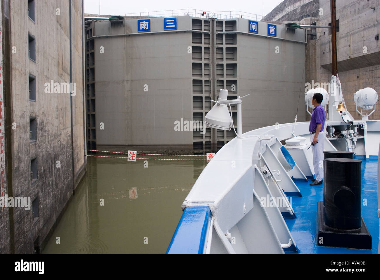 Deck hand on a cruise ship watching the gates in the ship lock on the ...