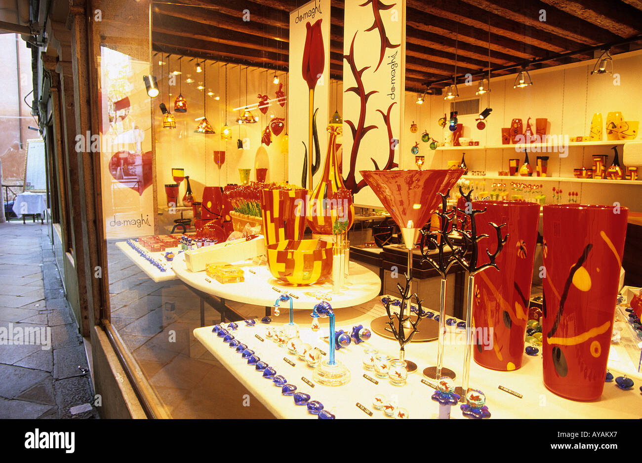 Glass shop exterior window display close up yellow and red Venice Stock ...