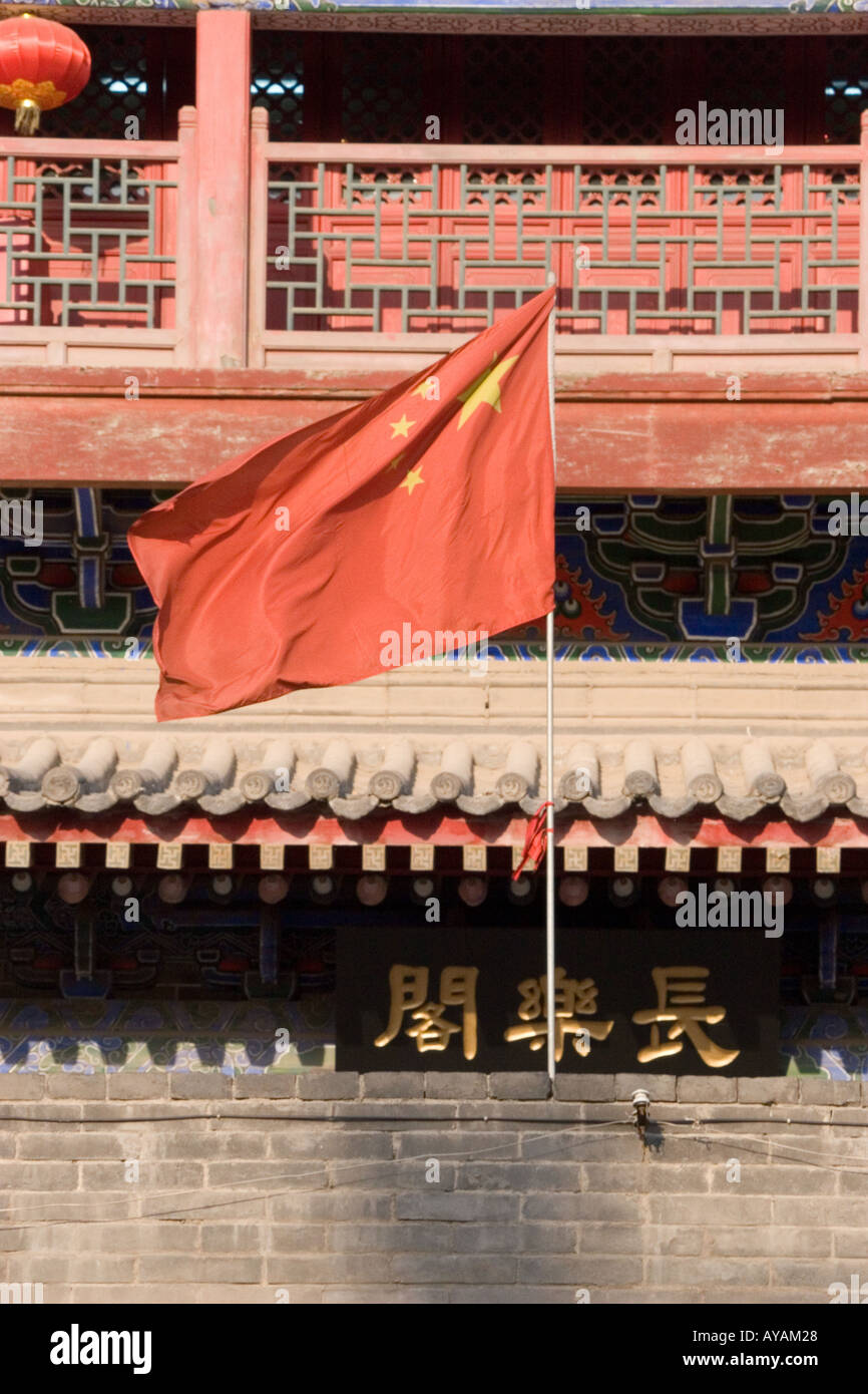 Chinese national flag flying at the entrance to the ancient inner city ...