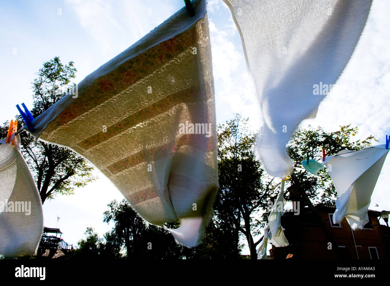 laundry on wash day flaps in stiff wind on clothesline on the island of ...
