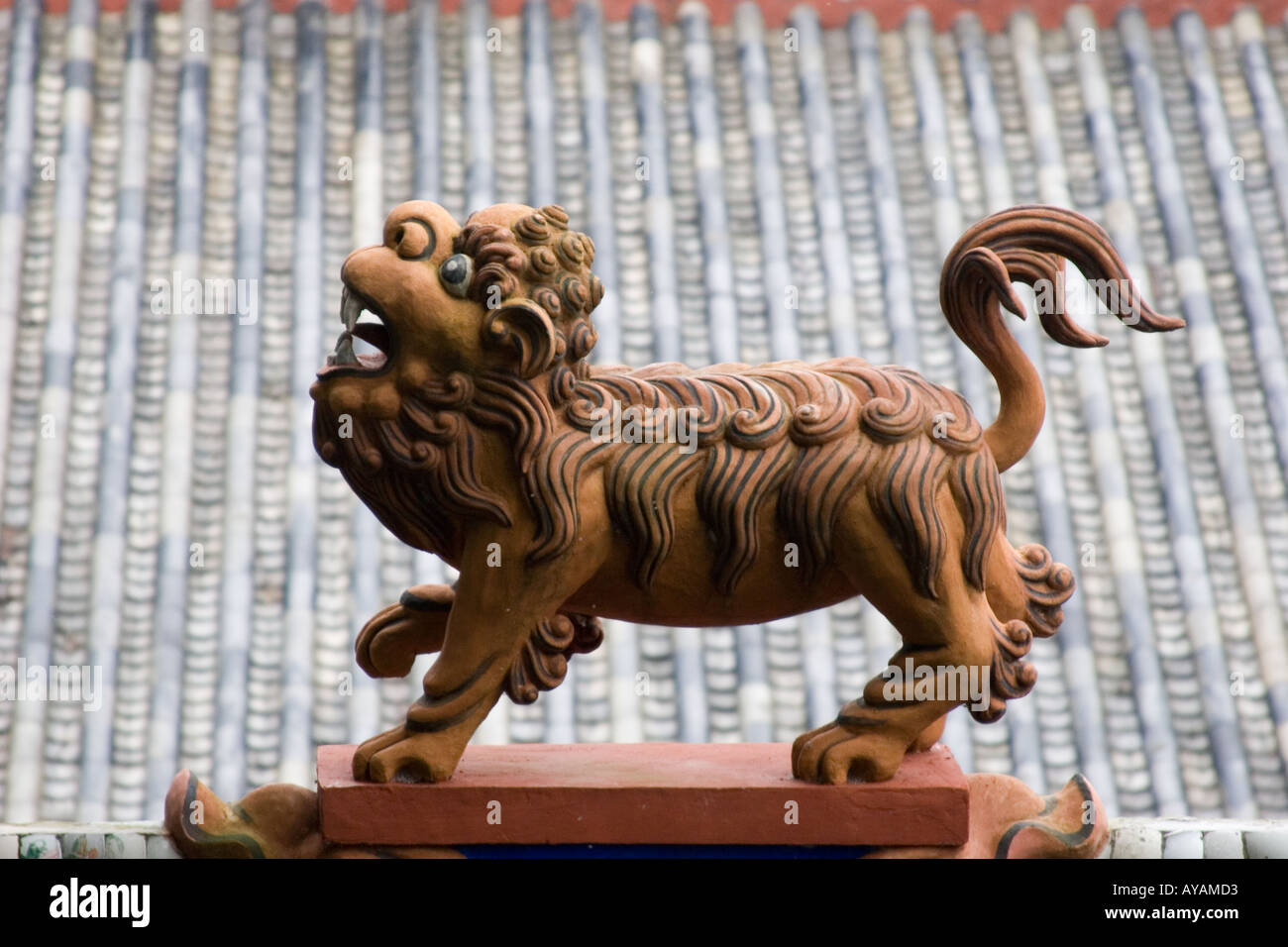 Colorful lion sculpture on a roof of a building in the Ghost City of ...