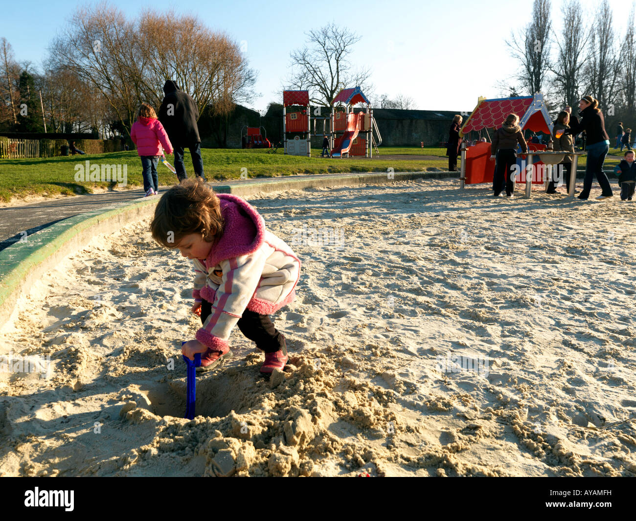 Child Digging Hole In Sandpit Stock Photo - Alamy