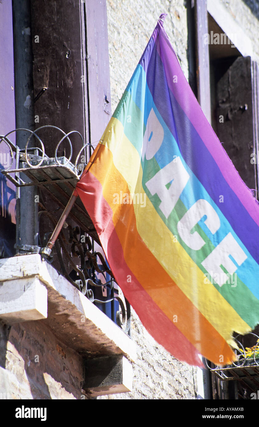 Peace flag on exterior wall colourful Stock Photo - Alamy