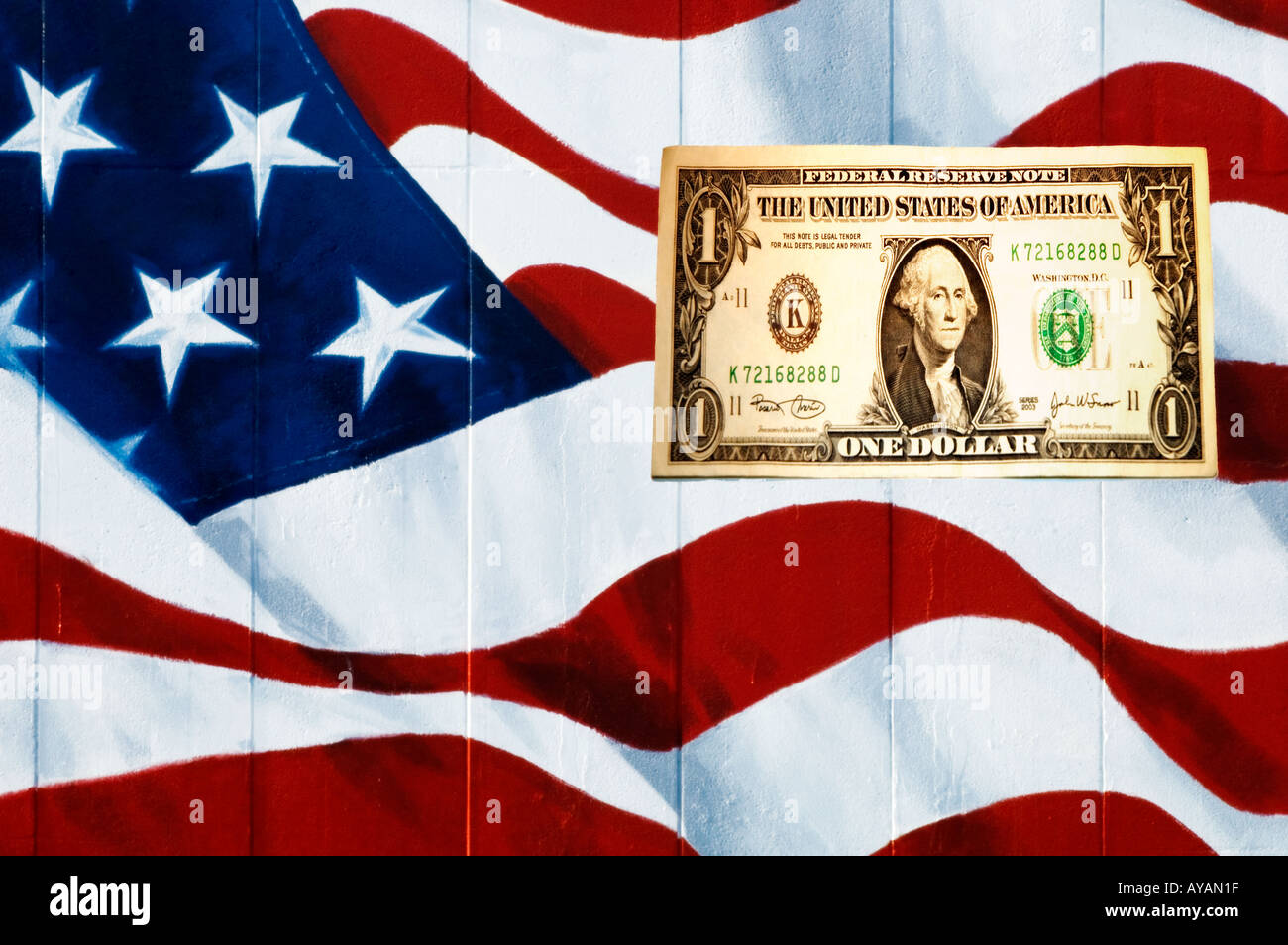 dollar bill behind united states flag Stock Photo - Alamy