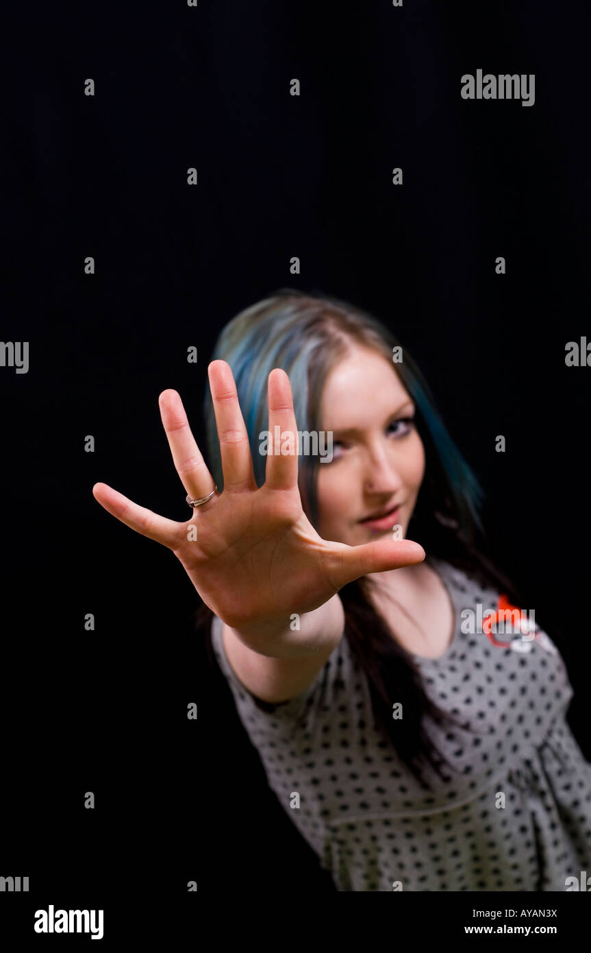Teenage girl hand up stop Stock Photo - Alamy