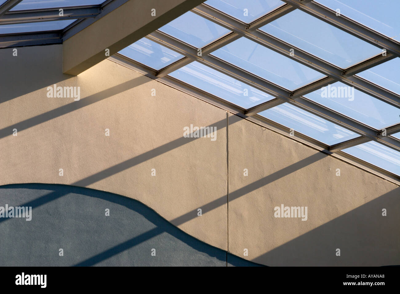 Skylight architecture with shadow patterns over swimming pool in health ...
