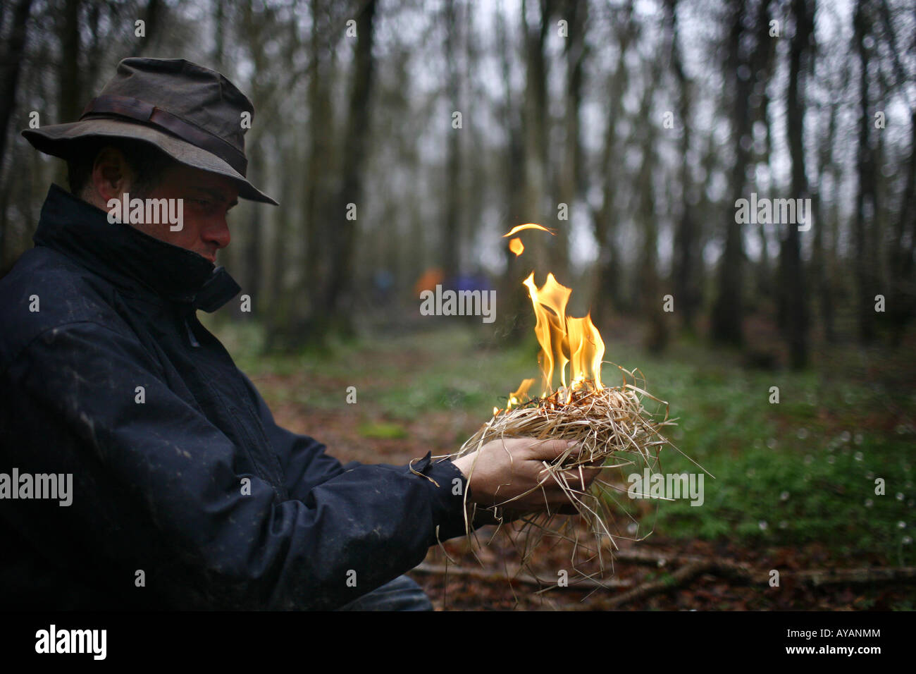 Man makes fire during bushcraft hi-res stock photography and images - Alamy